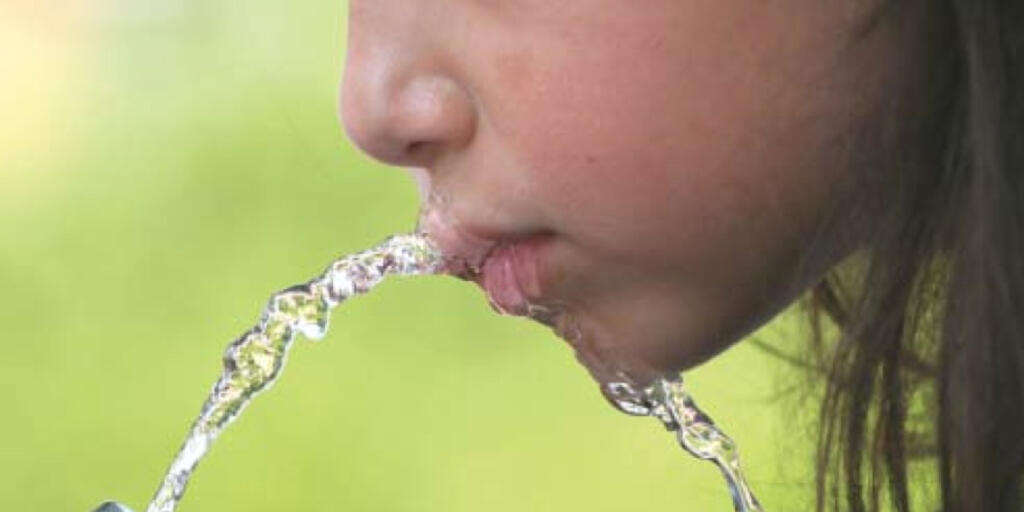 Poor Kid Drinking Water