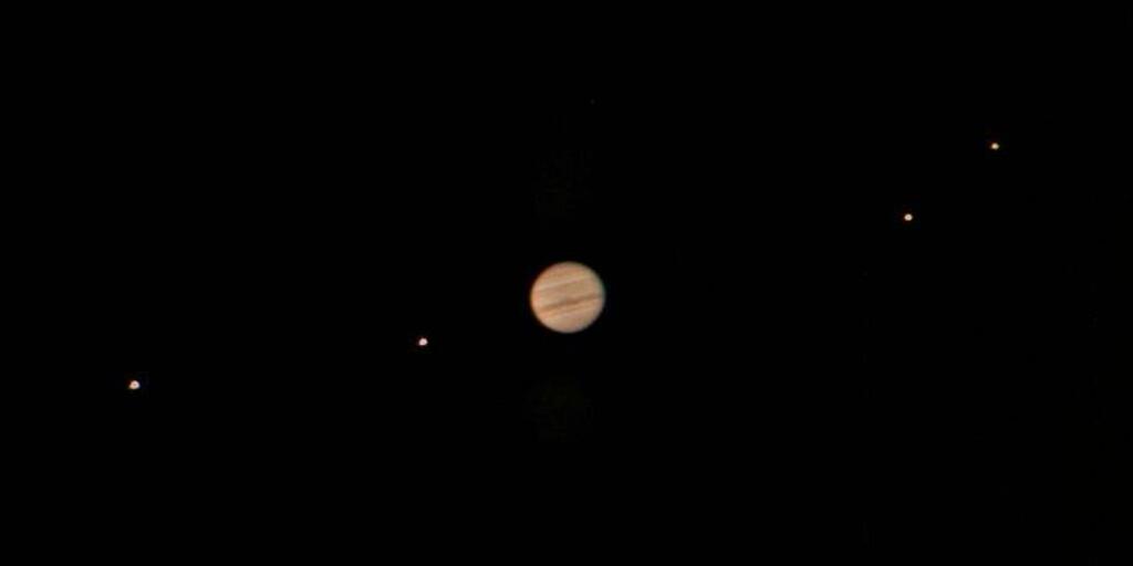 Jupiter And Its Moons Through A Telescope